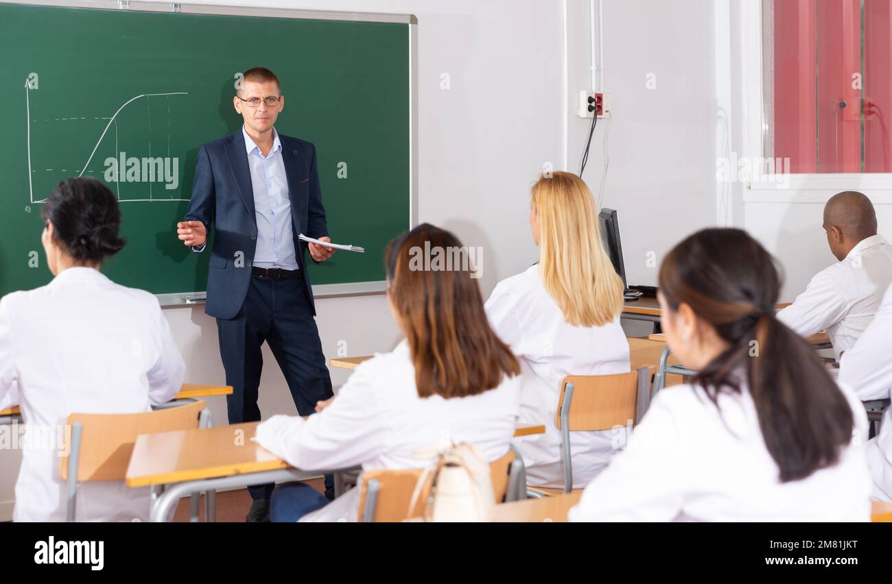 Young man listening attentively speaker hi-res stock photography and ...