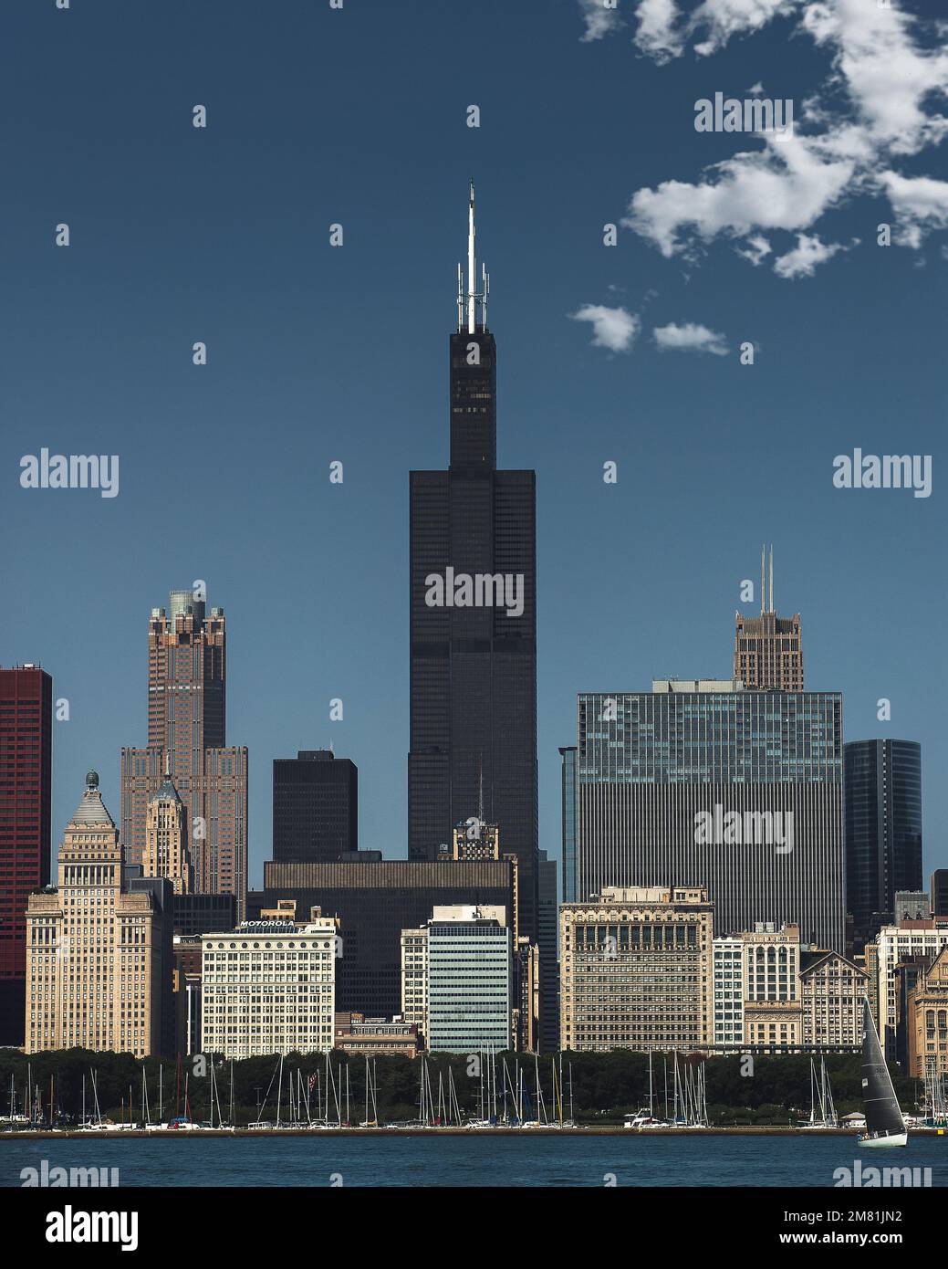 A vertical shot of the historic scenic Seattle skyline across the water ...
