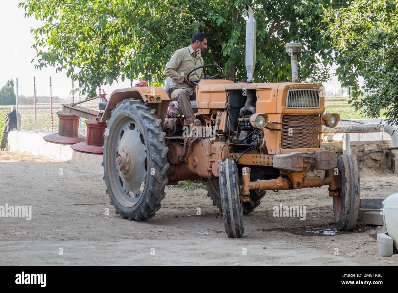 BAHAR, IRAN - JULY 13, 2019: Local farmer on his tractor near Bahar ...