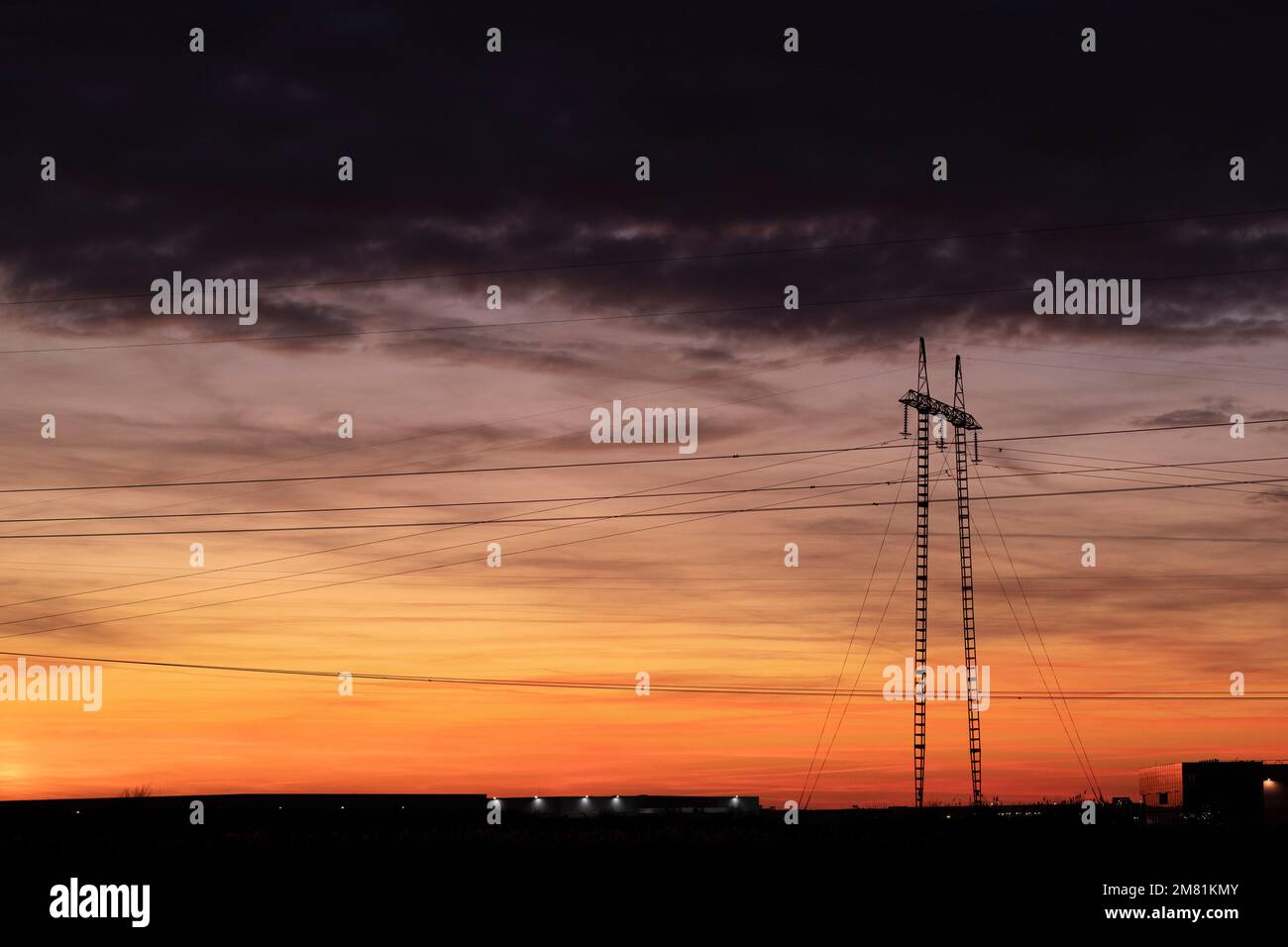high-voltage power lines at sunset,high voltage electric transmission ...