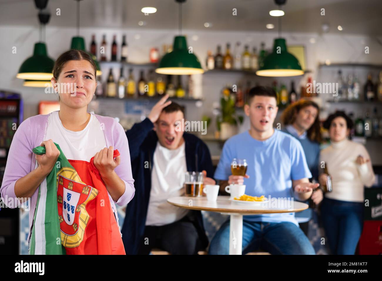 Sad young female fan holding state flag in hands and supporting ...