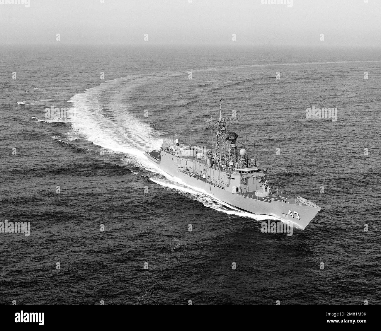 An elevated starboard bow view of the Oliver Hazard Perry class guided ...