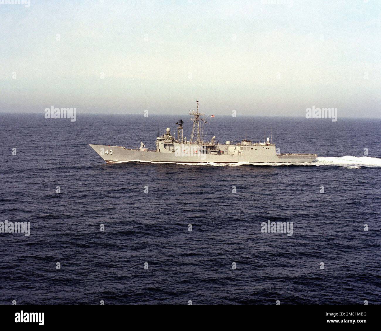 An aerial port beam view of the guided missile frigate THACH (FFG 43 ...