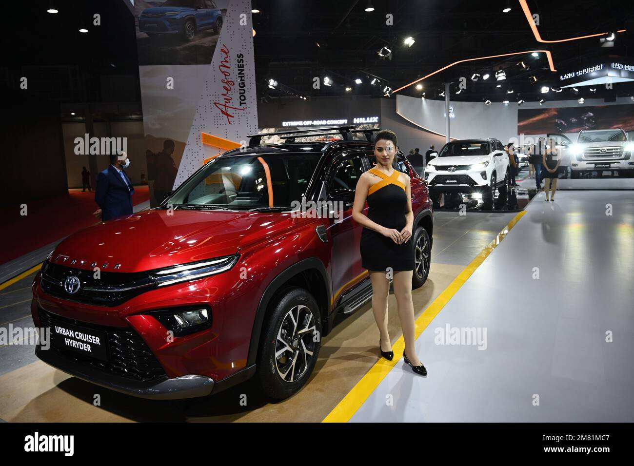 GREATER NOIDA, INDIA - JANUARY 11: A model poses next to Toyota Urban Cruiser Hyryder at the ...