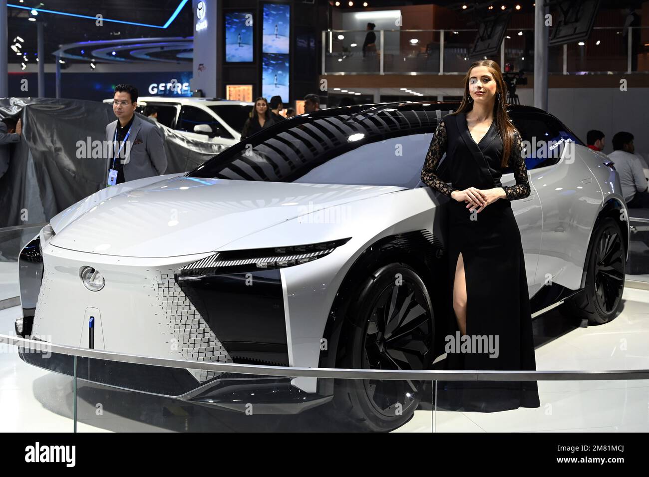 GREATER NOIDA, INDIA - JANUARY 11: A model poses next to a concept car from Lexus at the Auto ...