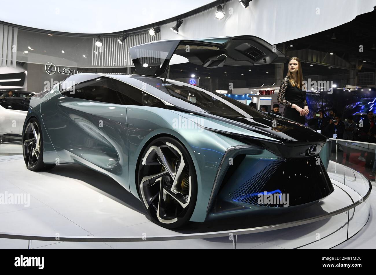 GREATER NOIDA, INDIA - JANUARY 11: A model poses next to a concept car from Lexus at the Auto ...