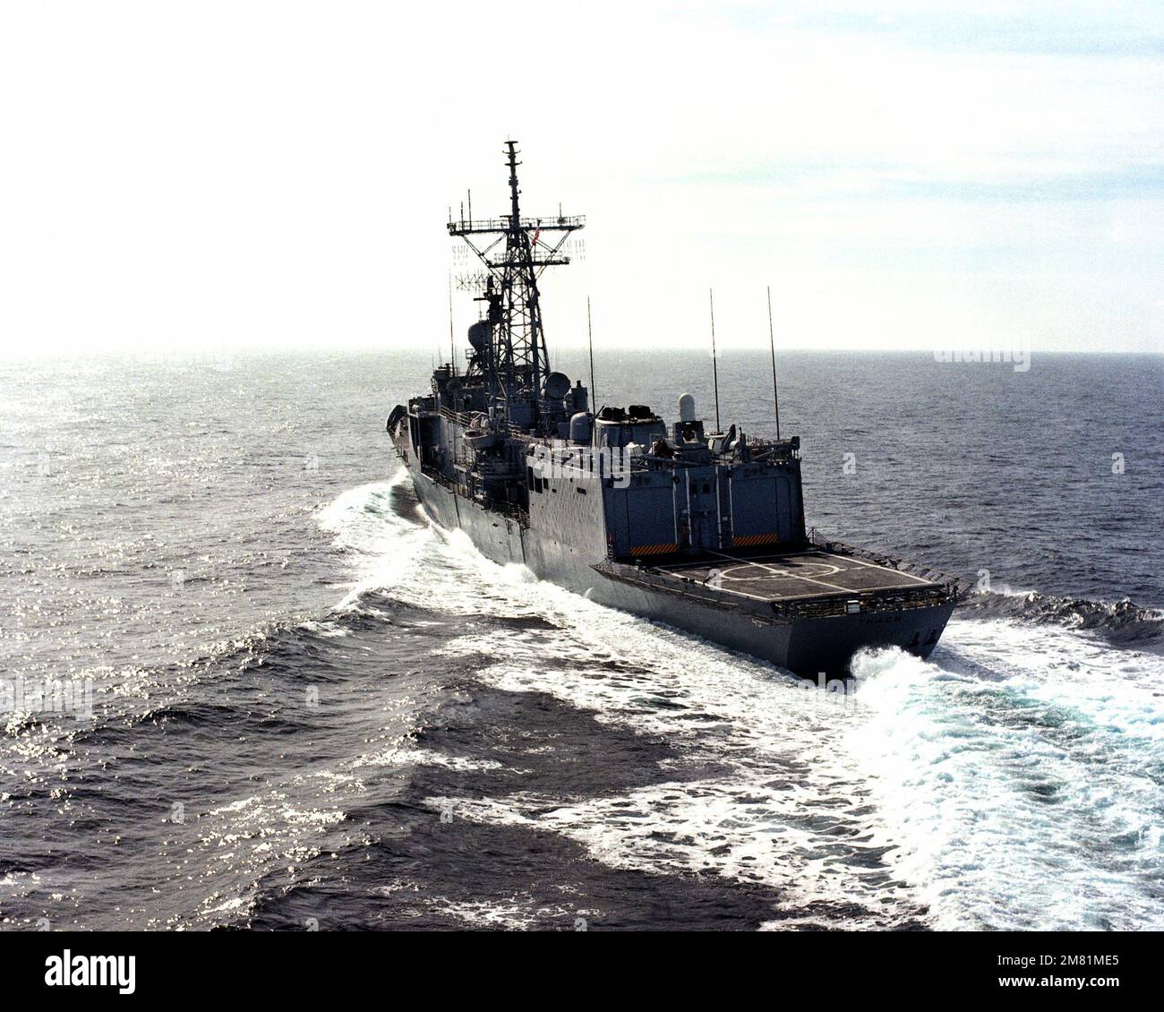 An aerial port quarter view of the guided missile frigate THACH (FFG 43 ...