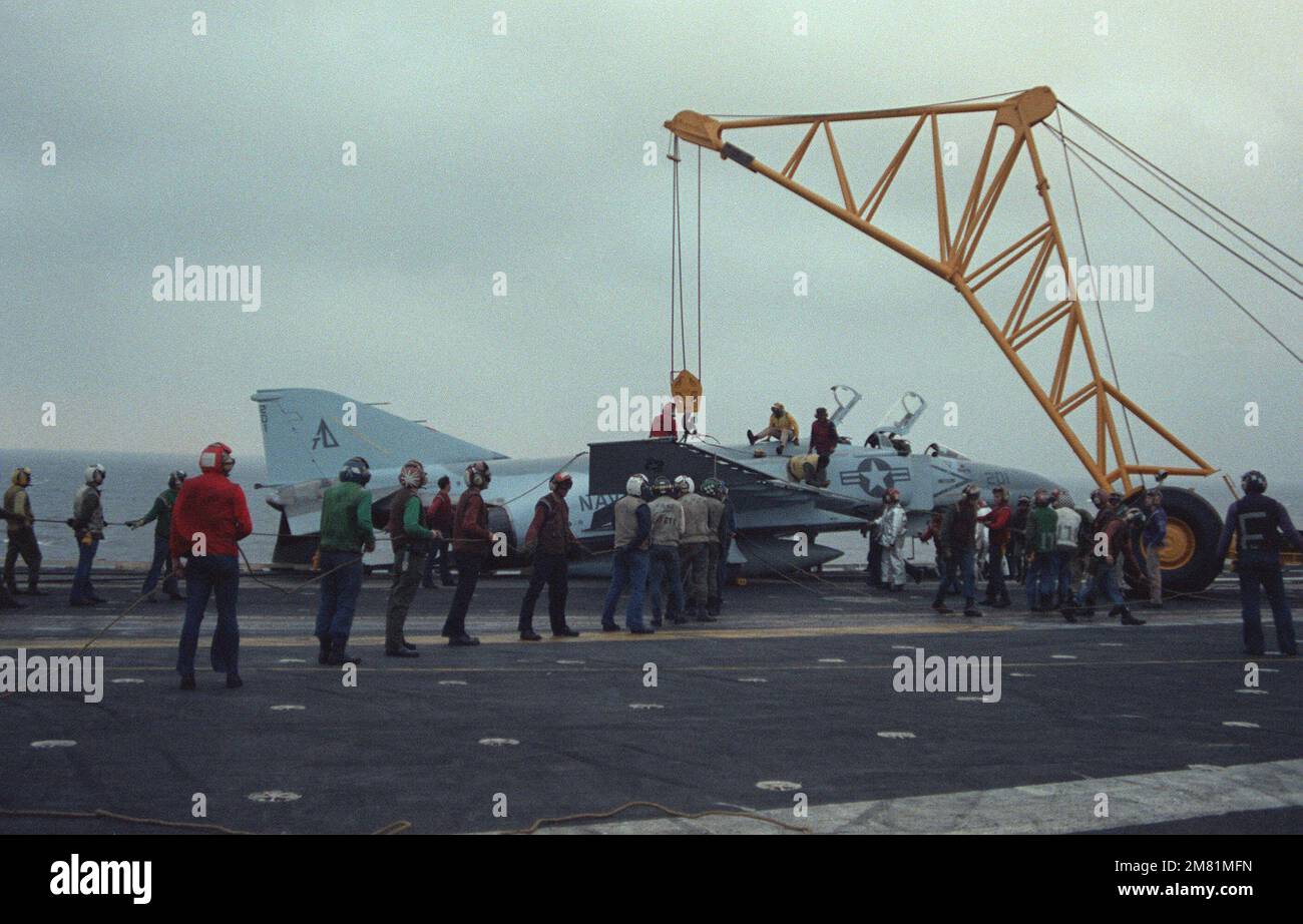 A fire fighting party stands by aboard the aircraft carrier USS AMERICA ...