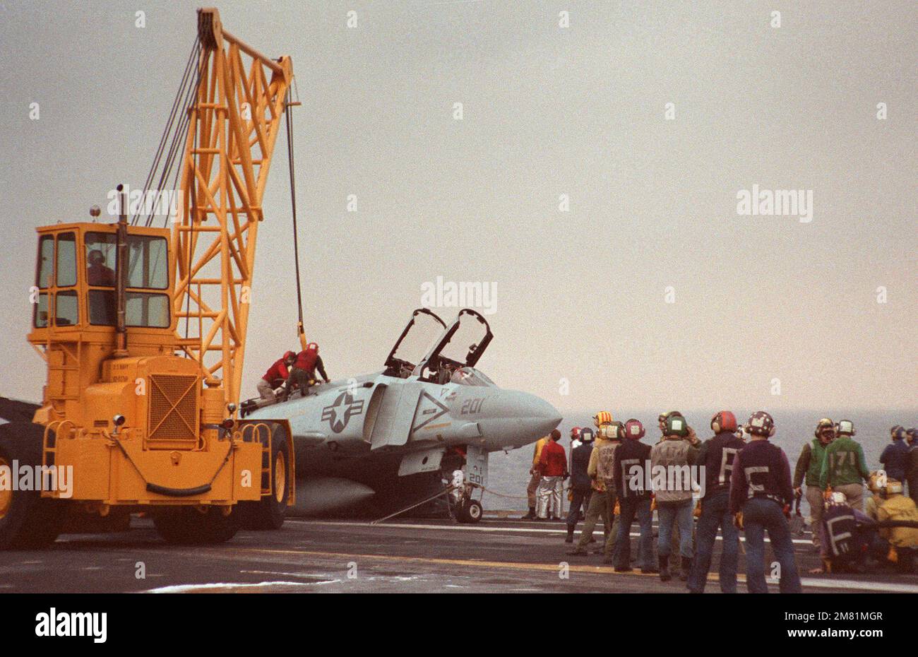 A fire fighting party stands by aboard the aircraft carrier USS AMERICA ...