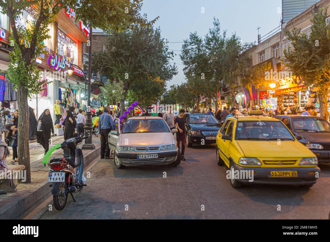 SHIRAZ, IRAN - JULY 6, 2019: Evening view of a street in Shiraz, Iran ...