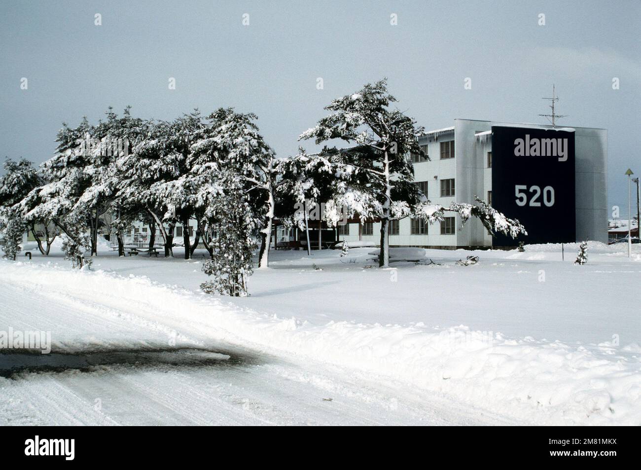 A recent snowfall covers the grounds around building No. 520. Base ...