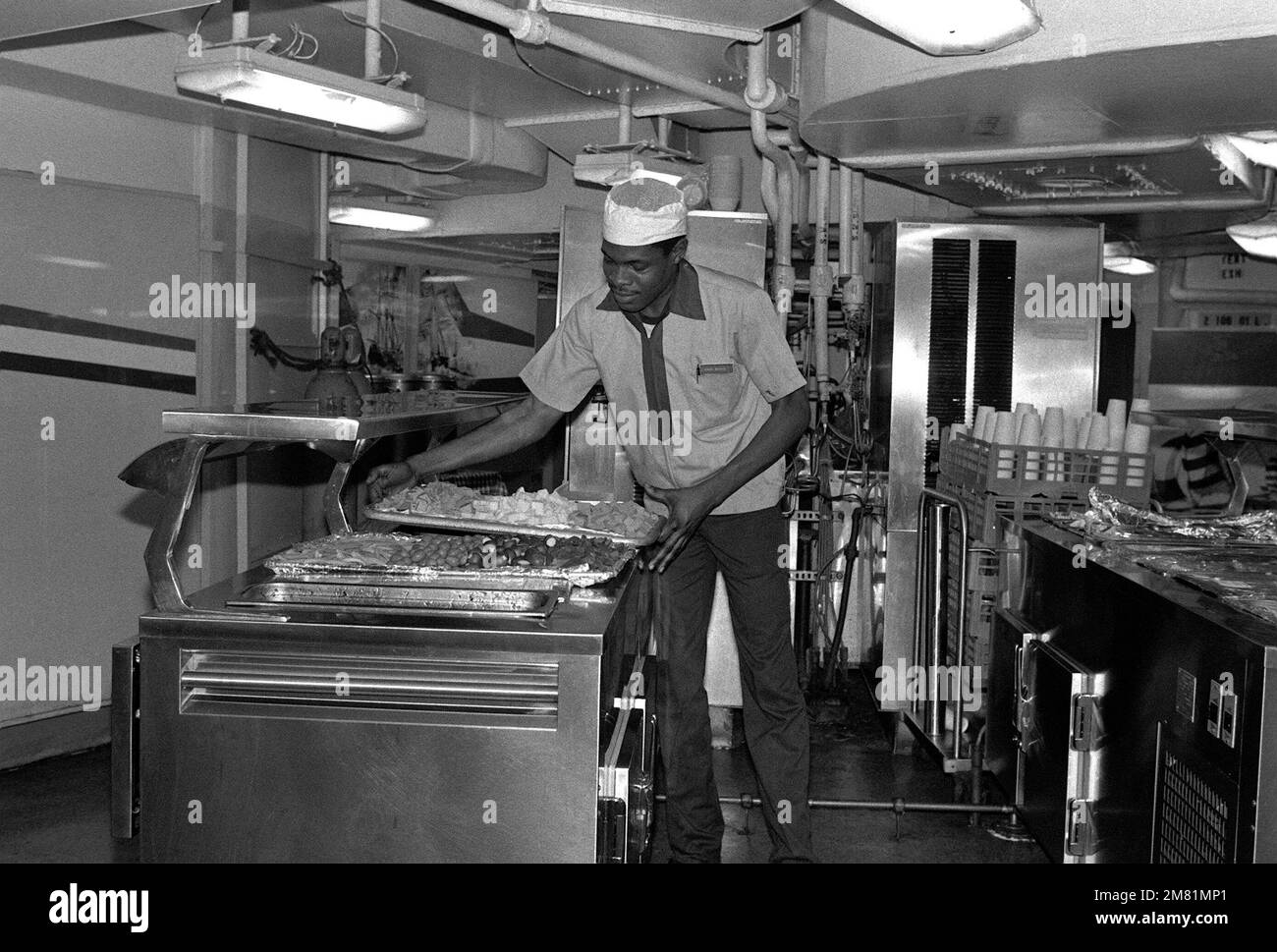 Mess Management SPECIALIST SEAMAN (MSSN) James Banks prepares the salad ...