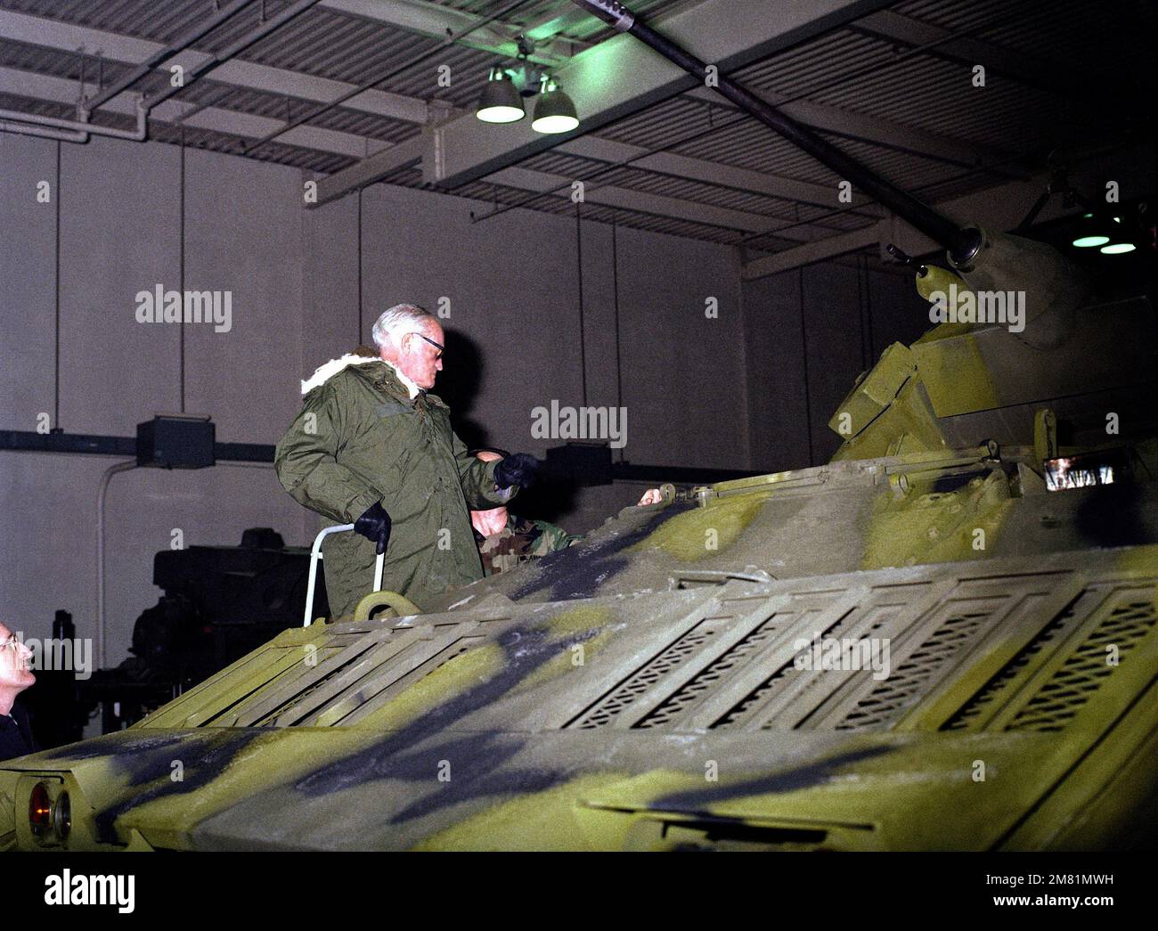 Retired US Senator Barry M. Goldwater stands on a ladder to view an M2 ...