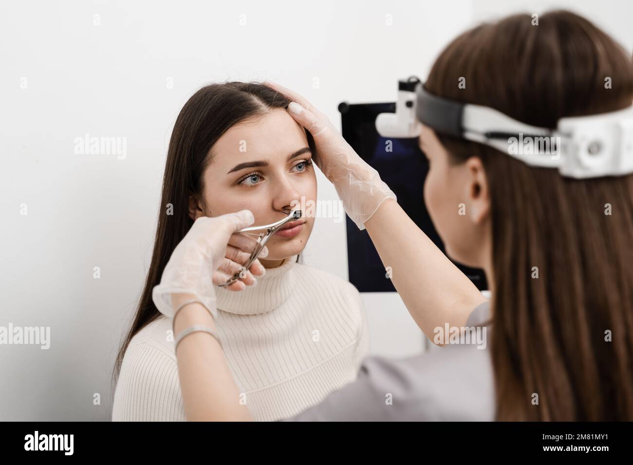 Rhinoscopy of woman nose. Consultation with ENT doctor ...
