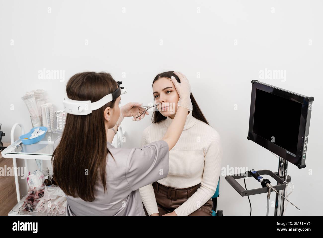 Rhinoscopy of woman nose. Consultation with ENT doctor ...