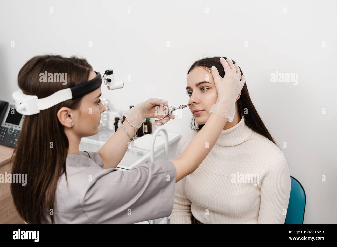 Rhinoscopy of woman nose. Consultation with ENT doctor ...