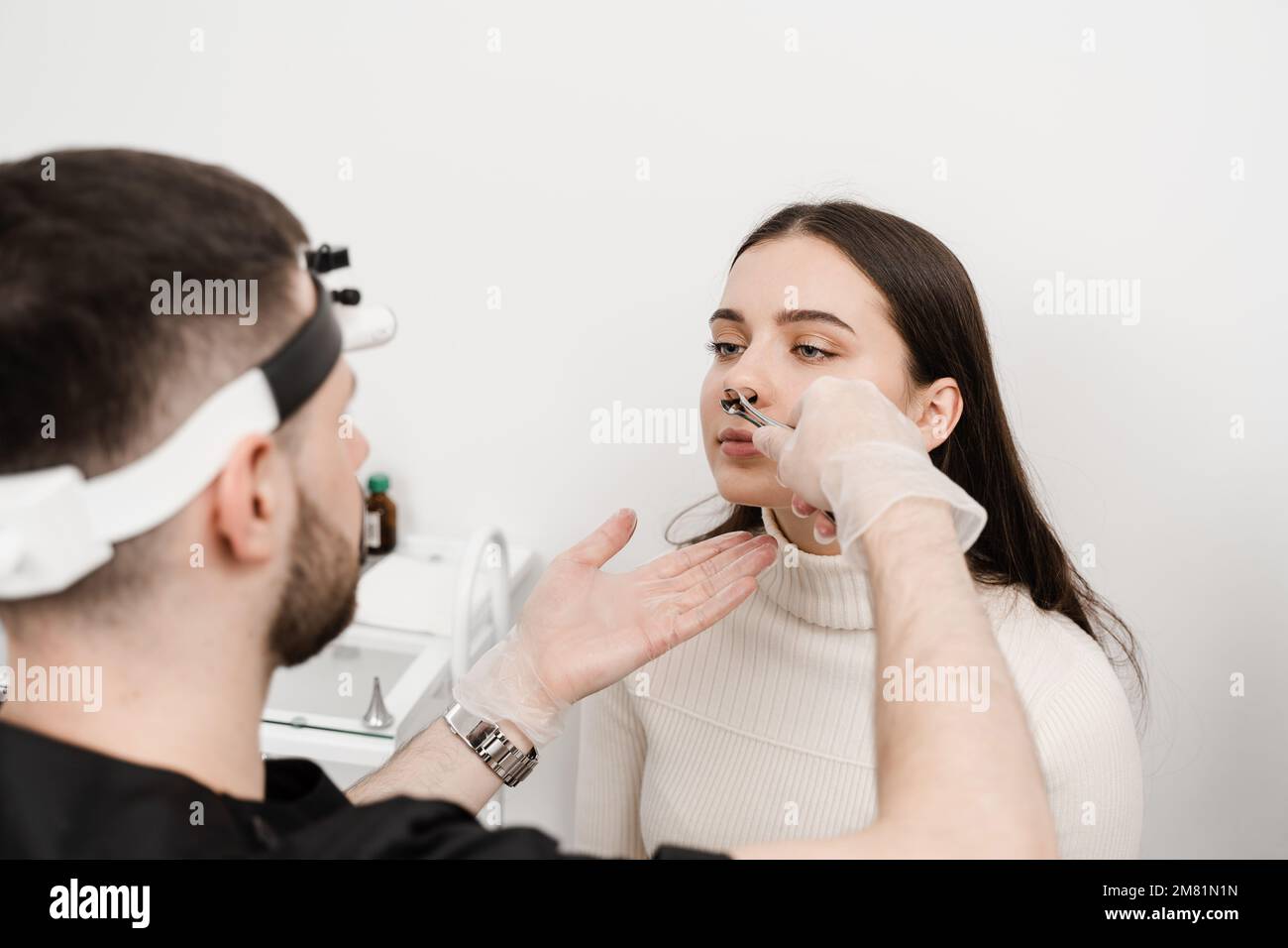 Rhinoscopy of woman nose. Consultation with ENT doctor ...