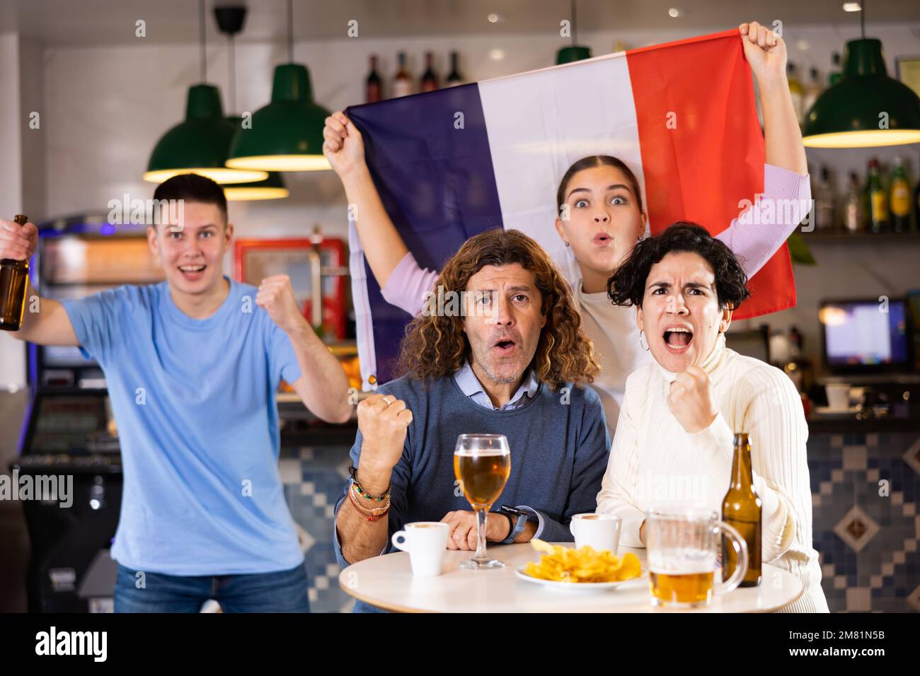 Joyful friends with France flag celebrating victory of favorite team in ...