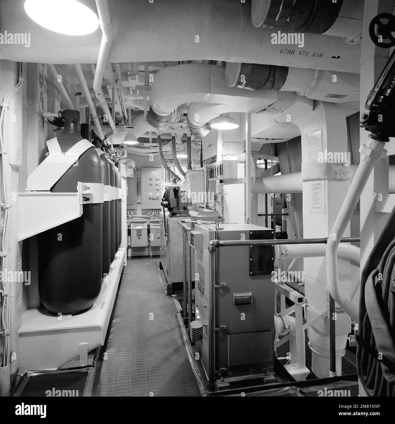 An interior view of the main engine room on the guided missile frigate ...
