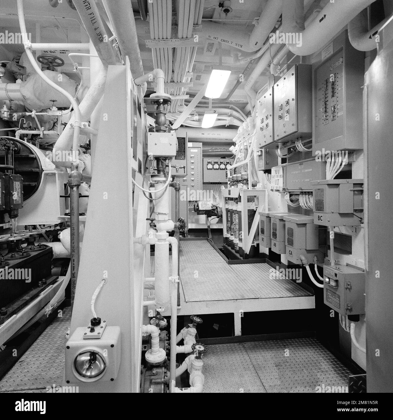 An interior view of auxiliary machine room No. 3 on the guided missile ...