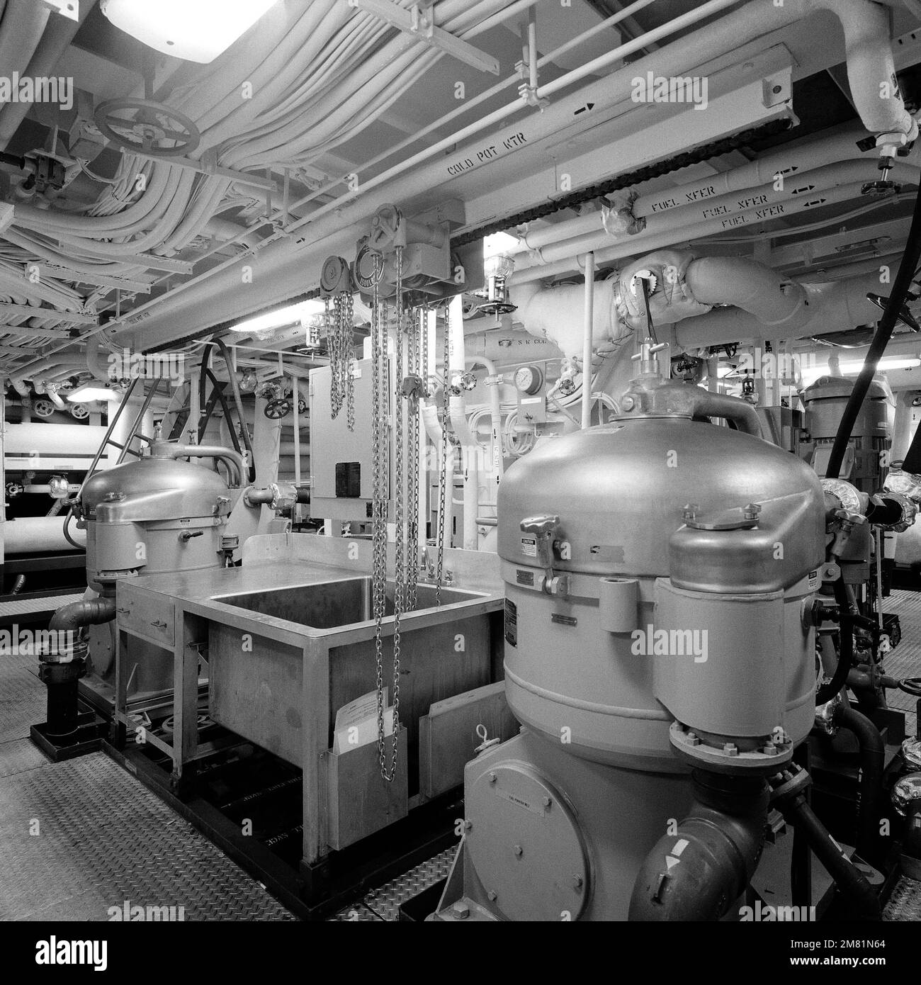 An interior view of auxiliary machine room No. 2 on the guided missile ...