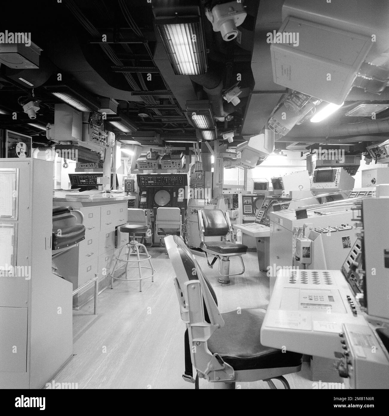 An interior view of the combat information center on the guided missile ...