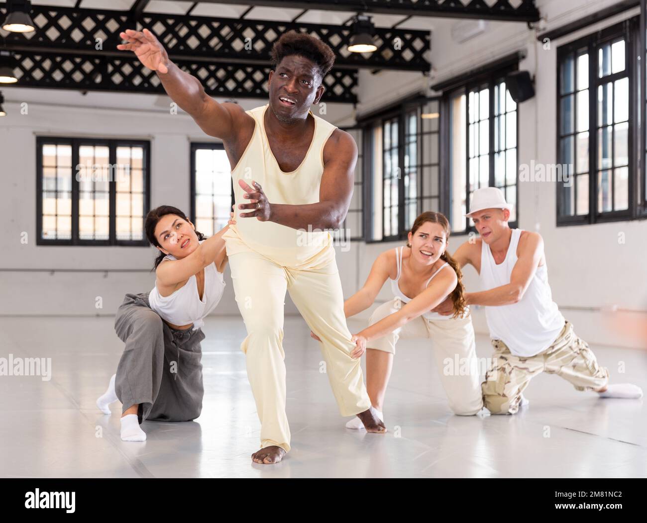 Four artists rehearsing spectacle scene Stock Photo - Alamy