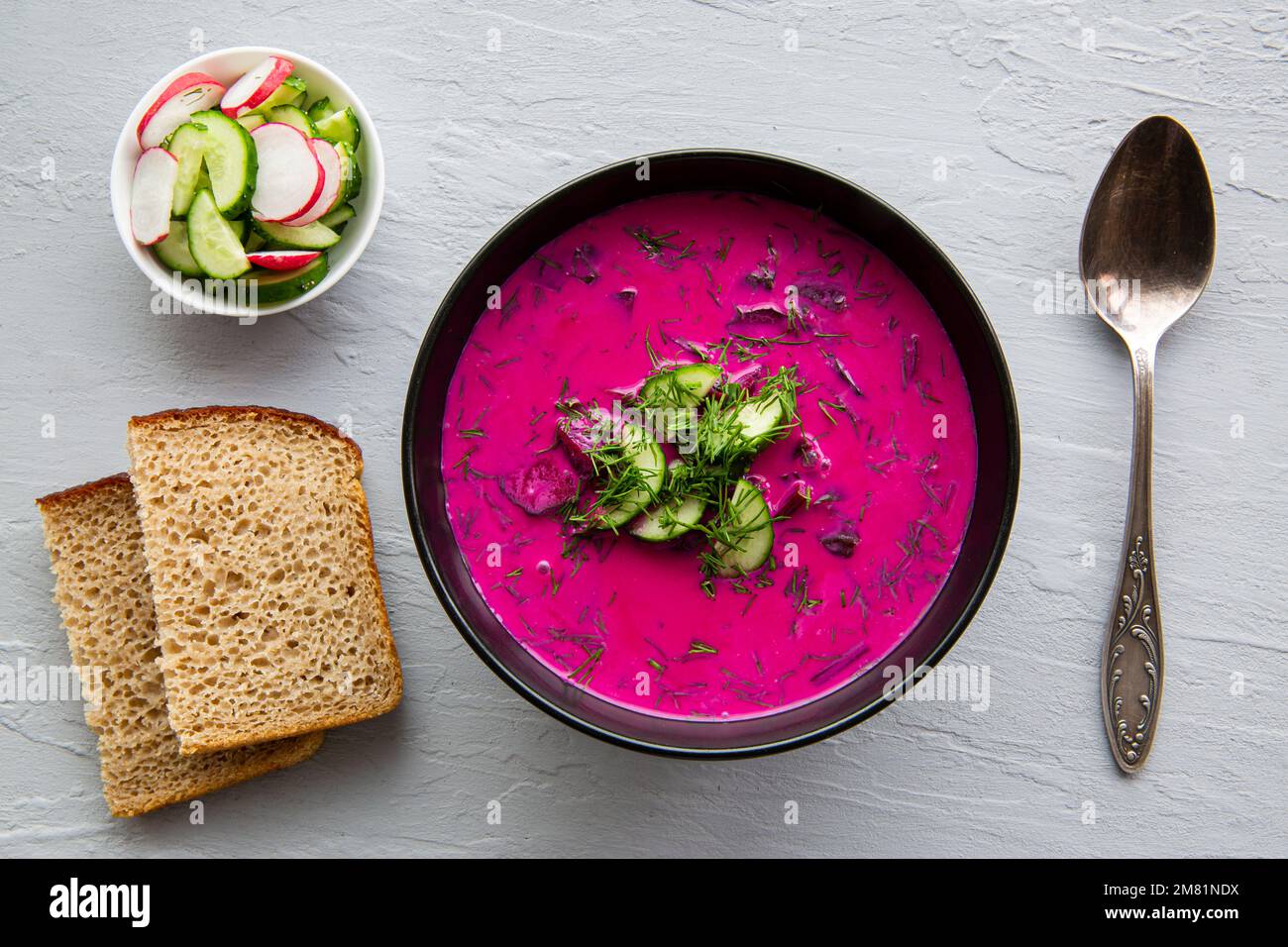 Tasty summer soup chlodnik with cucumber and radish on grey marble ...