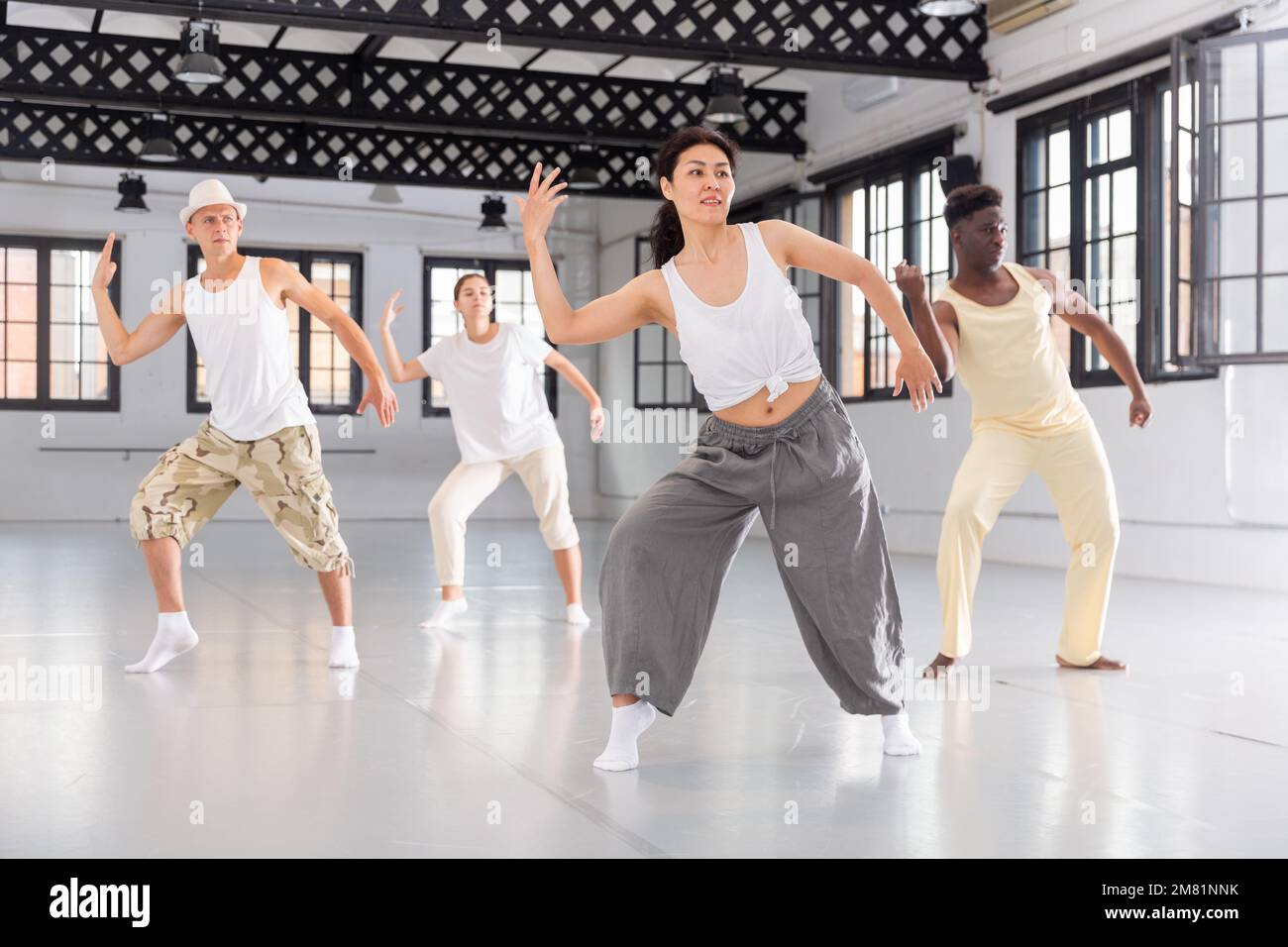 Group of young people learning modern dance movements Stock Photo - Alamy