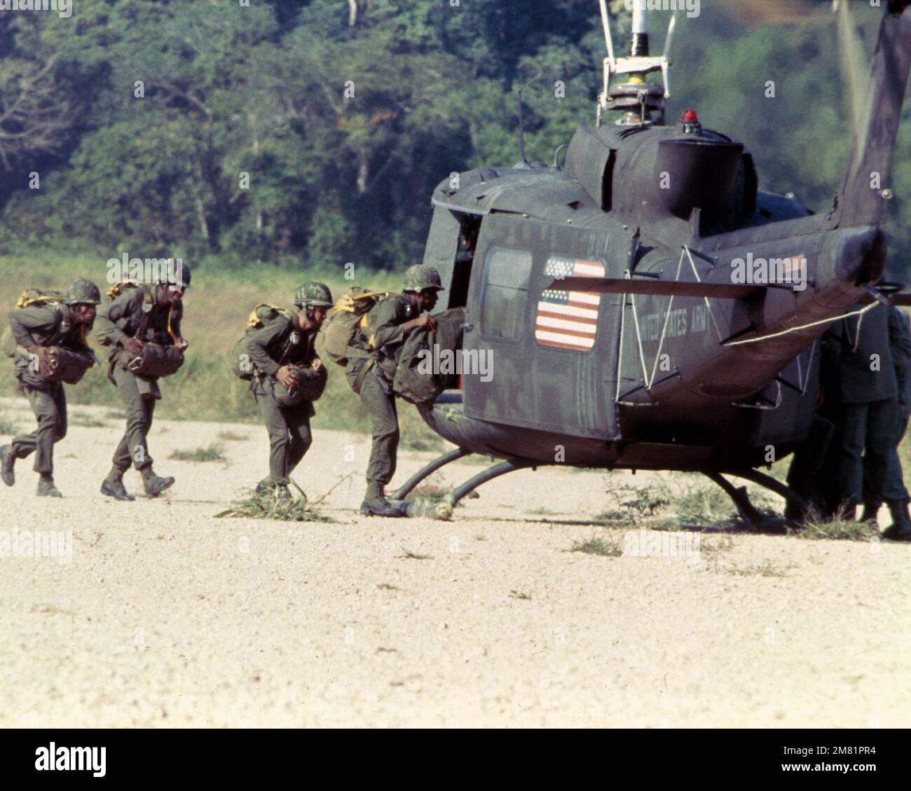 Panama Defense Force soldiers board a UH-1 Iroquois helicopter for ...