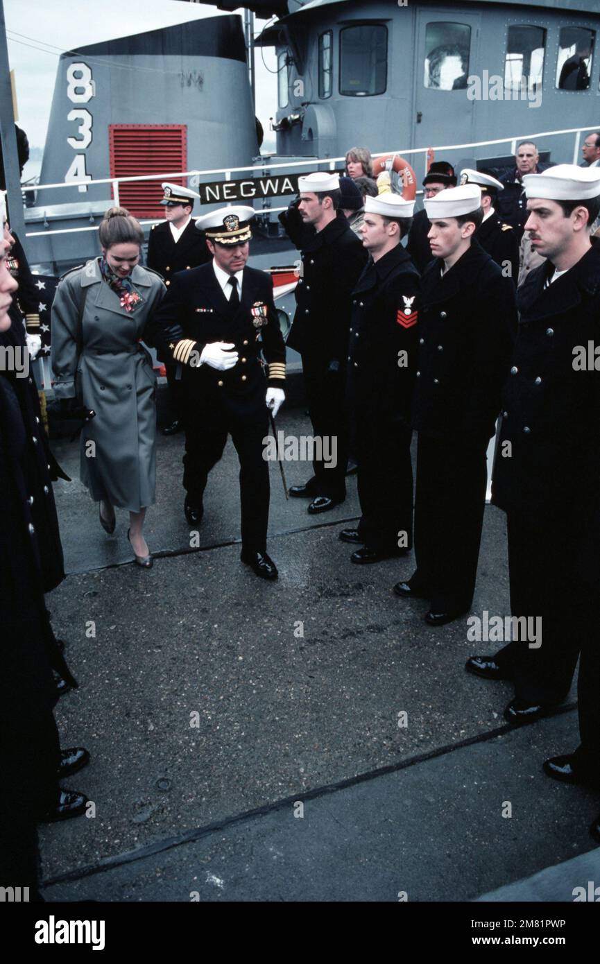 Susan Watkins is escorted to her seat on the speakers platform by ...