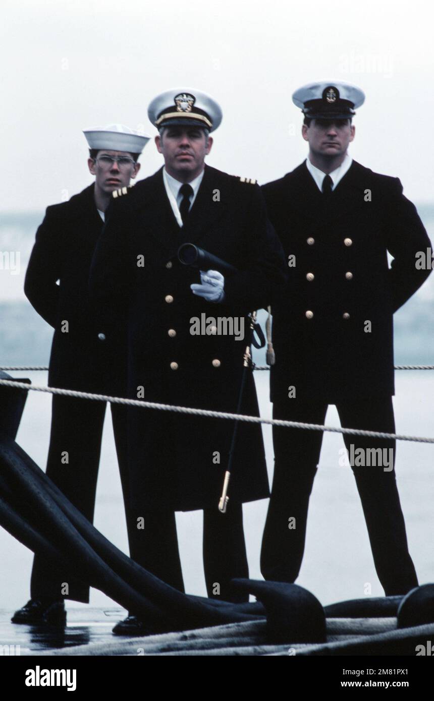 Holding the traditional telescope Lieutenant Commander William Stone ...