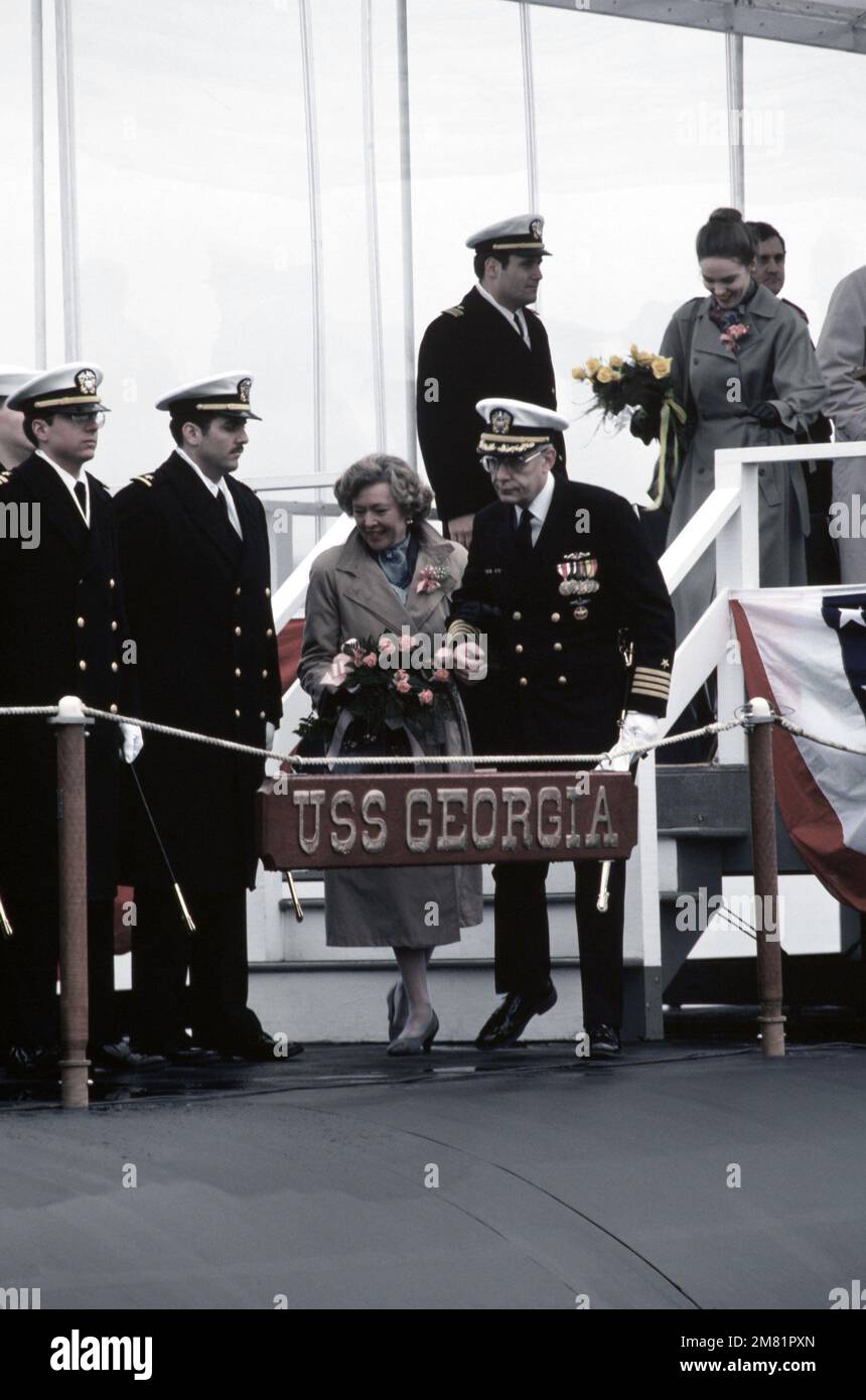 Captain Arland W. Kuester, commanding officer, escorts Sheila M ...