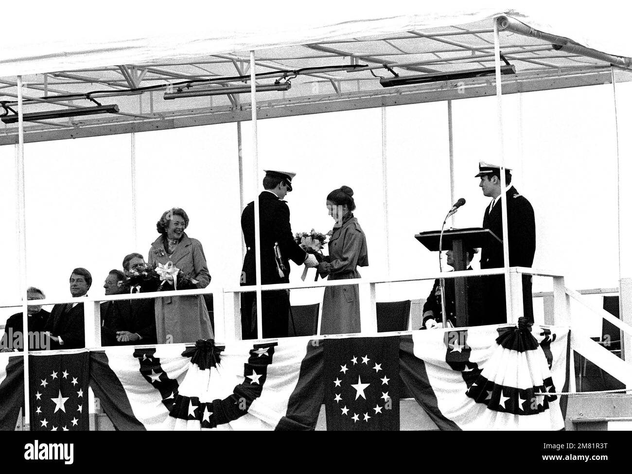 Flowers are presented to Susan Watkins during the commissioning ...
