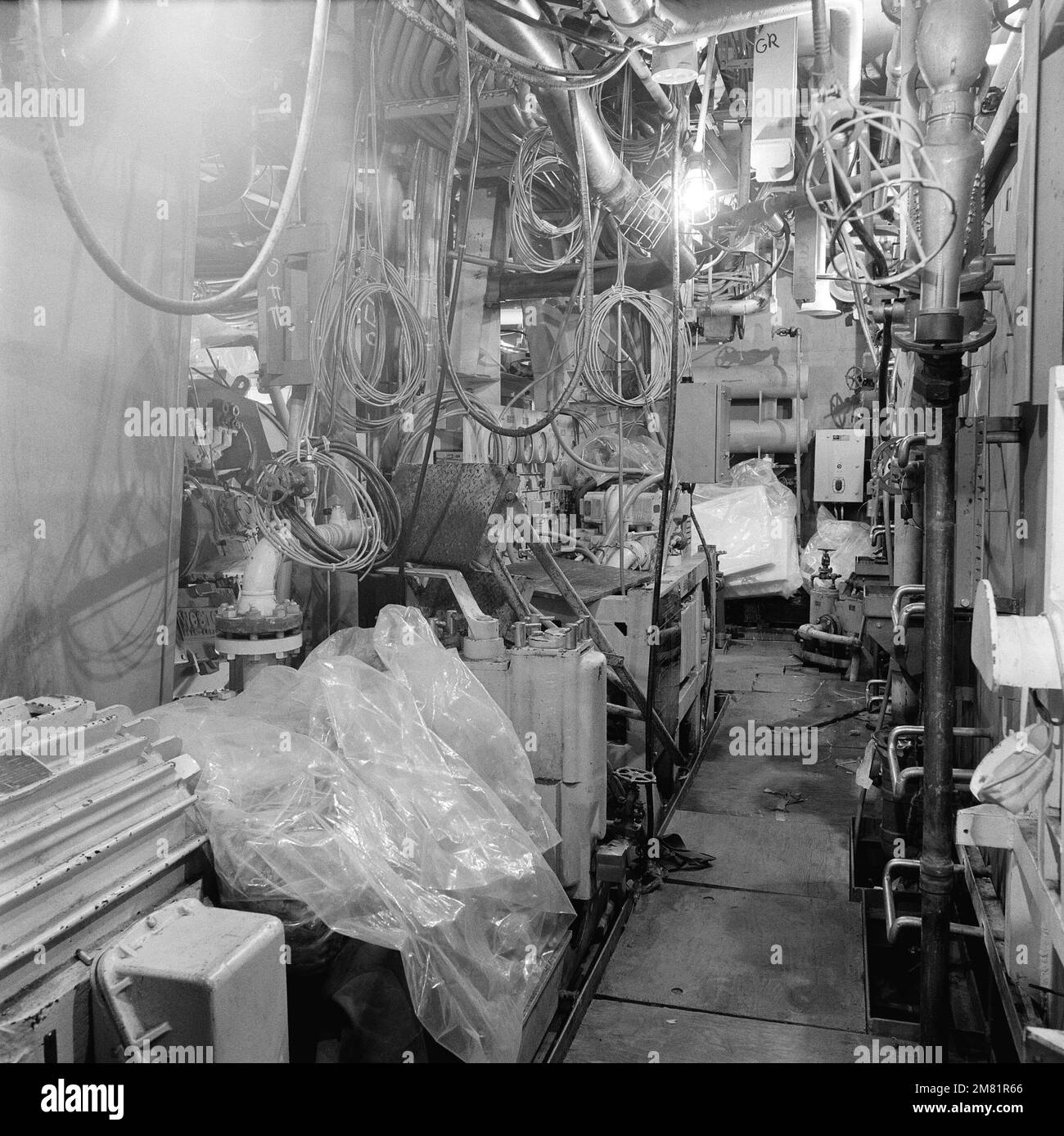 An interior view of the main engine room on the guided missile frigate ...
