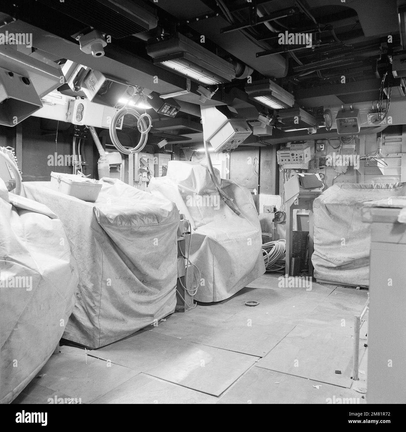 An interior view of the combat information center on the guided missile ...