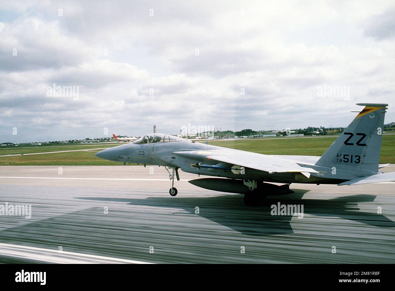 Left side view of an F-15 Eagle aircraft as it takes off. The F-15 is ...