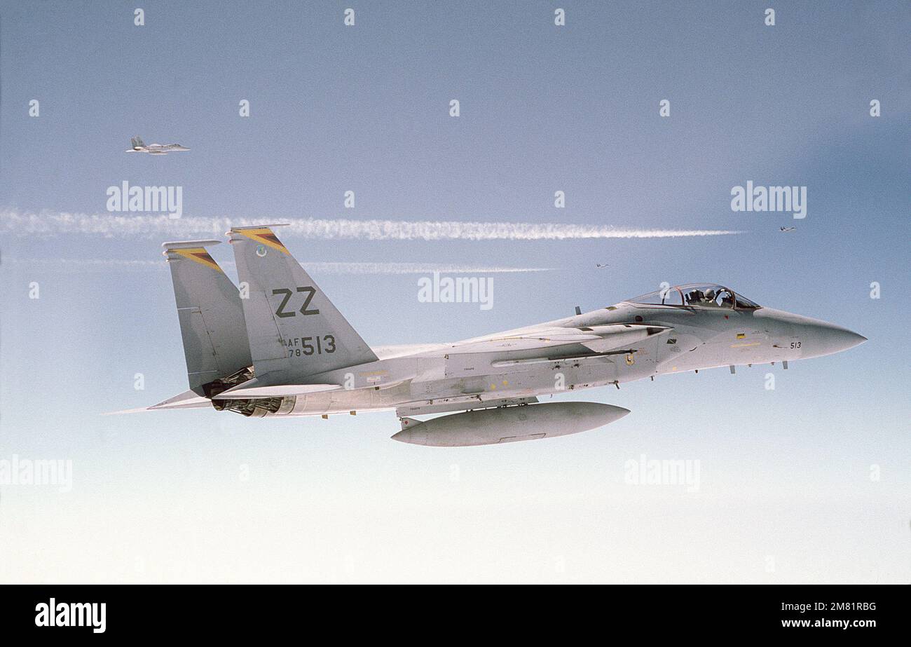 An air-to-air right side view of an F-15 Eagle aircraft, assigned to ...