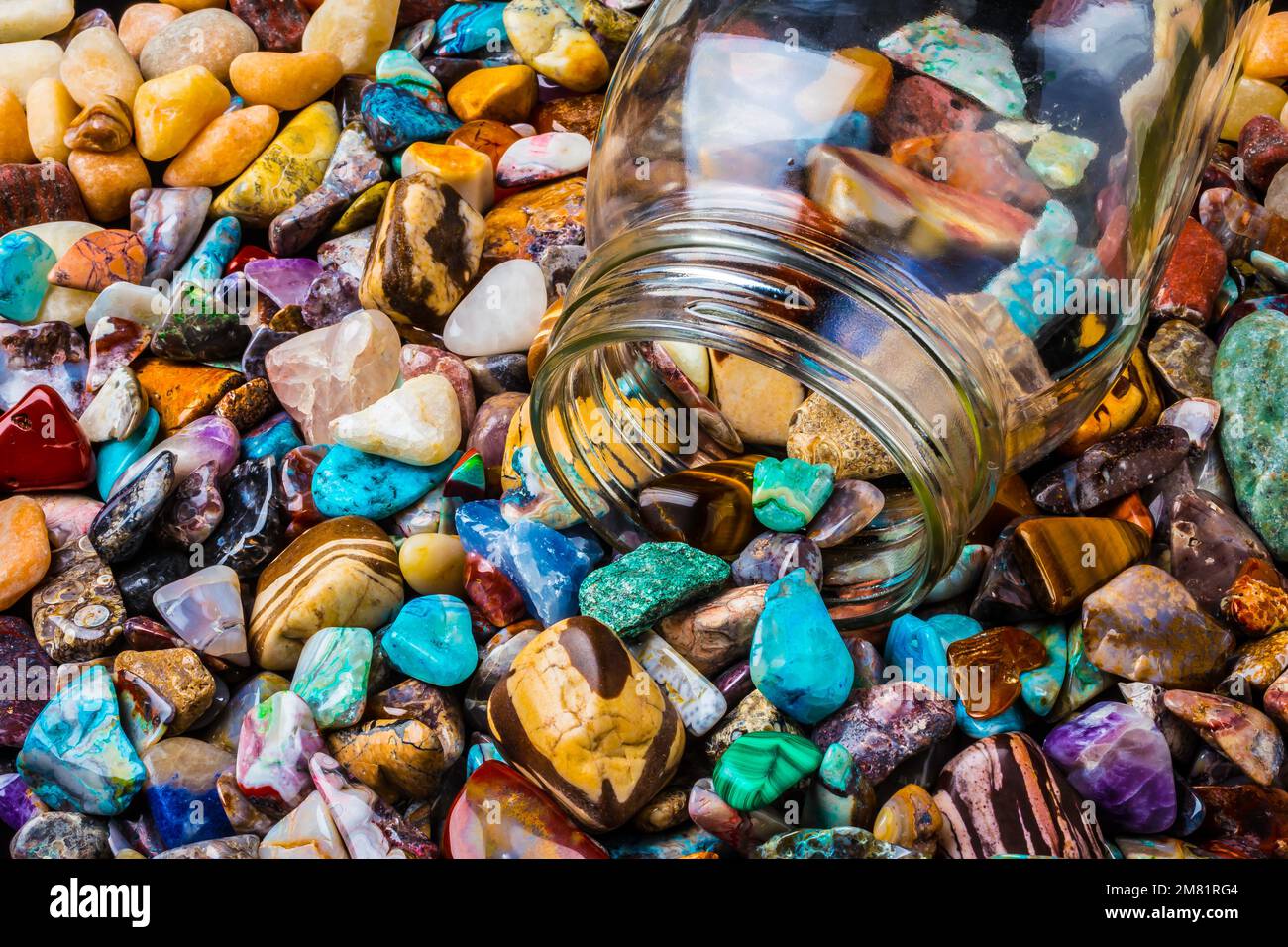 Rocks Pouring Out Of Glass Jar Stock Photo - Alamy