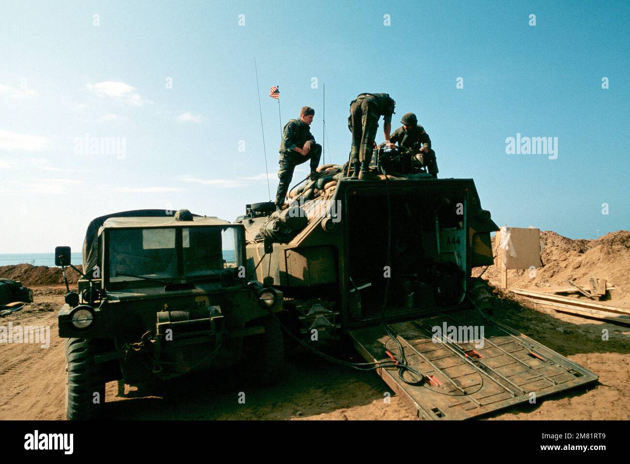 Marines from the 22nd Marine Amphibious Unit perform maintenance on an ...