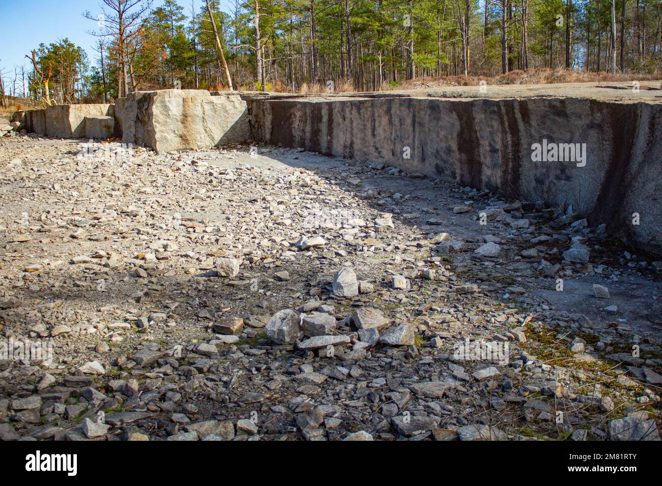 The long sharp edge of an old stone quarry in Atlanta, Georgia. Drill ...