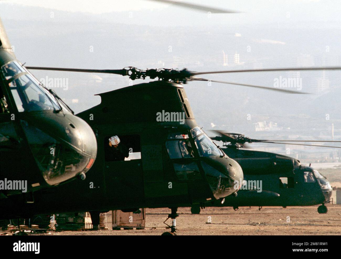 Marine CH-46 Sea Knights and a CH-53E Stallion helicopter (front ...