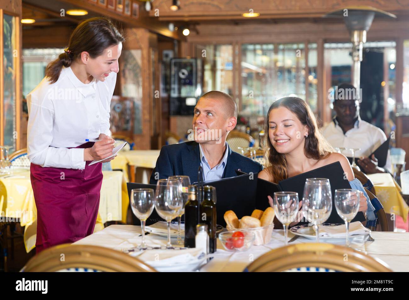 Positive waitress taking order hi-res stock photography and images - Alamy