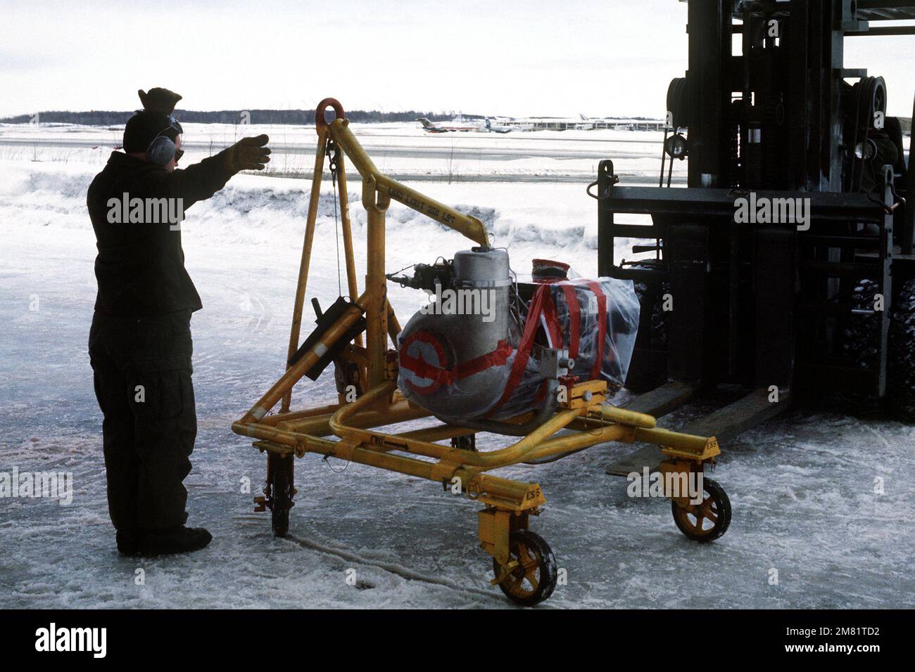 A member of the 144th Tactical Airlift Squadron (TASq), Air National ...