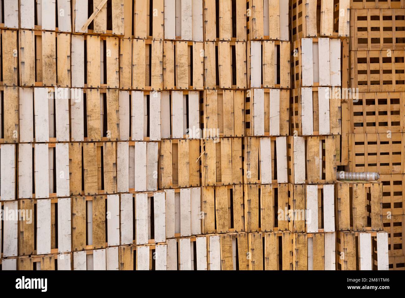 Wooden crates stacked in pile Stock Photo - Alamy