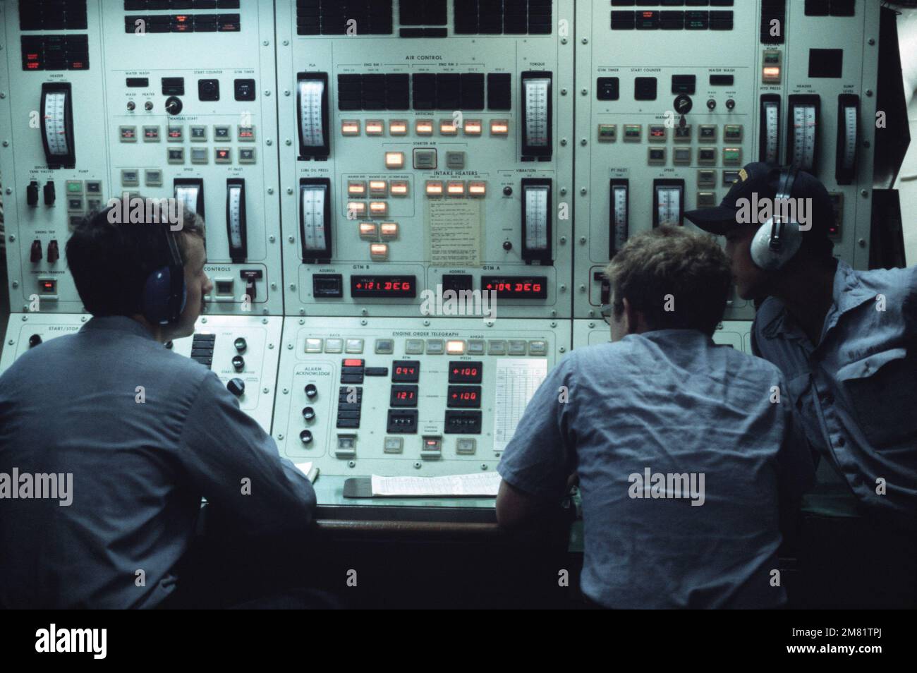 Technicians monitor the propulsion system of the Aegis guided missile ...