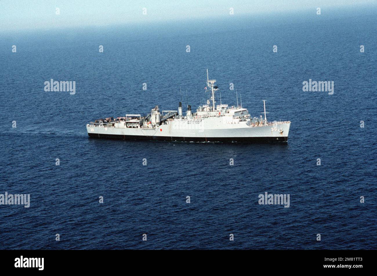 An elevated starboard bow view of the dock landing ship USS FORT ...