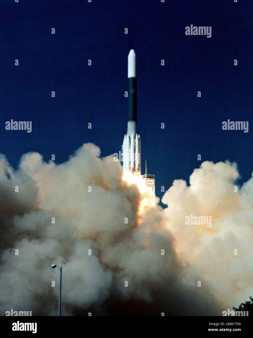 A Thor-Delta launch vehicle lifts off from Space Launch Center Two West ...