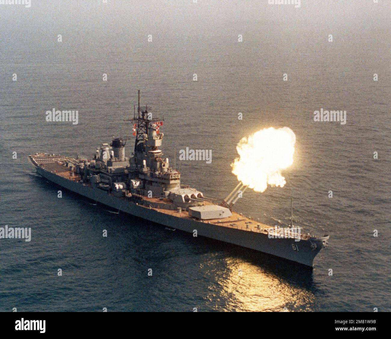 An Aerial Starboard Bow View Of The Battleship Uss Iowa Bb 61 Firing A 2700 Pound Projectile