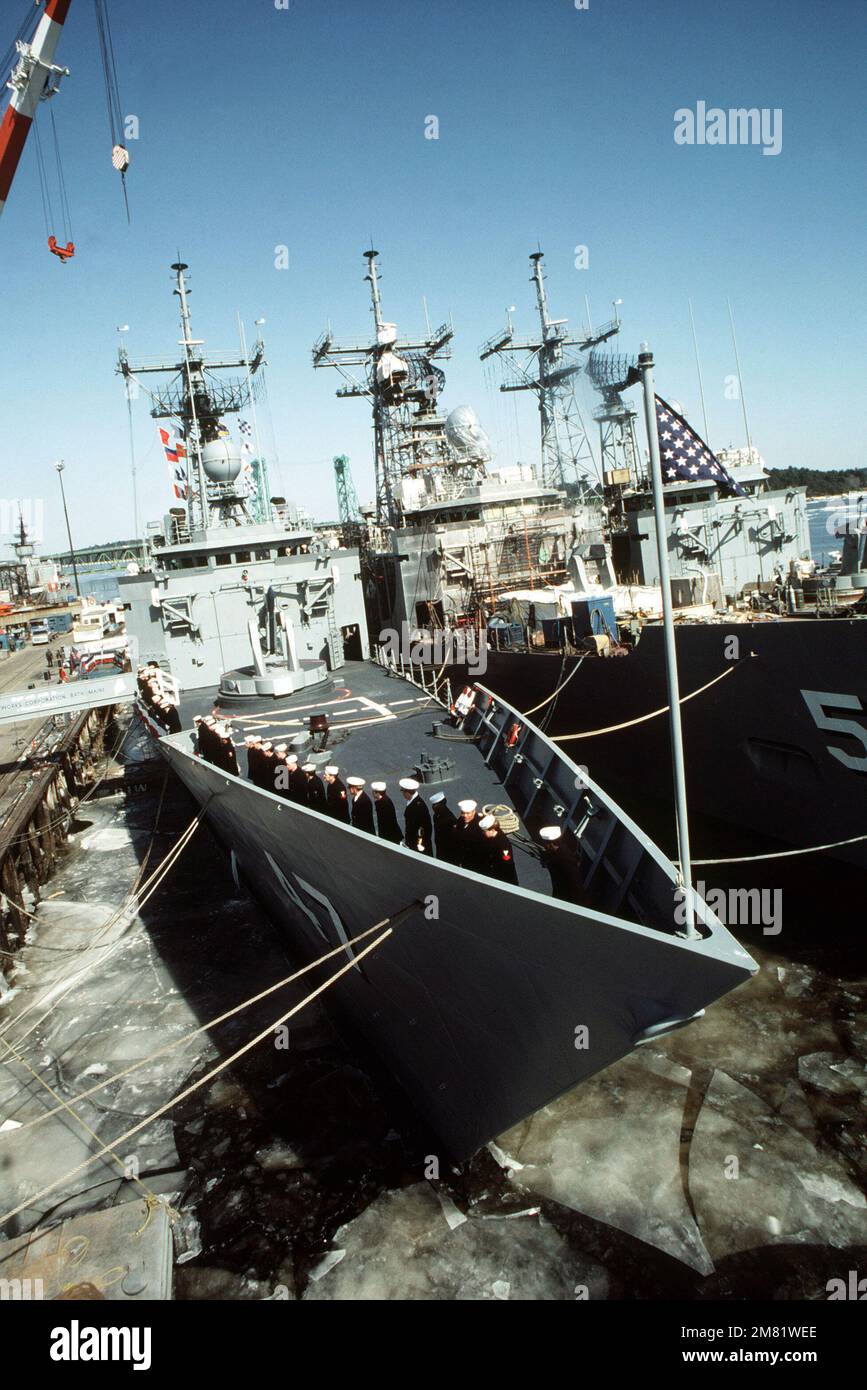 Crewman line the starbaord rail of the Oliver Hazard Perry-class guided ...